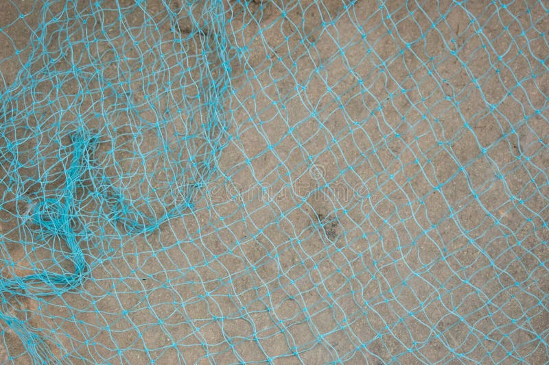 Close-up Photograph of Blue Fishing Net on Concrete Surface Stock Image ...