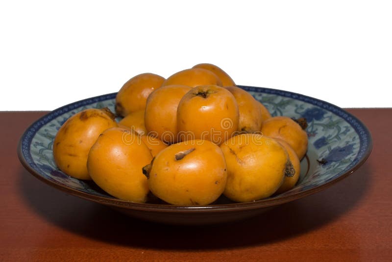 Loquat fruit in the dish stock photo. Image of harvest - 172351964
