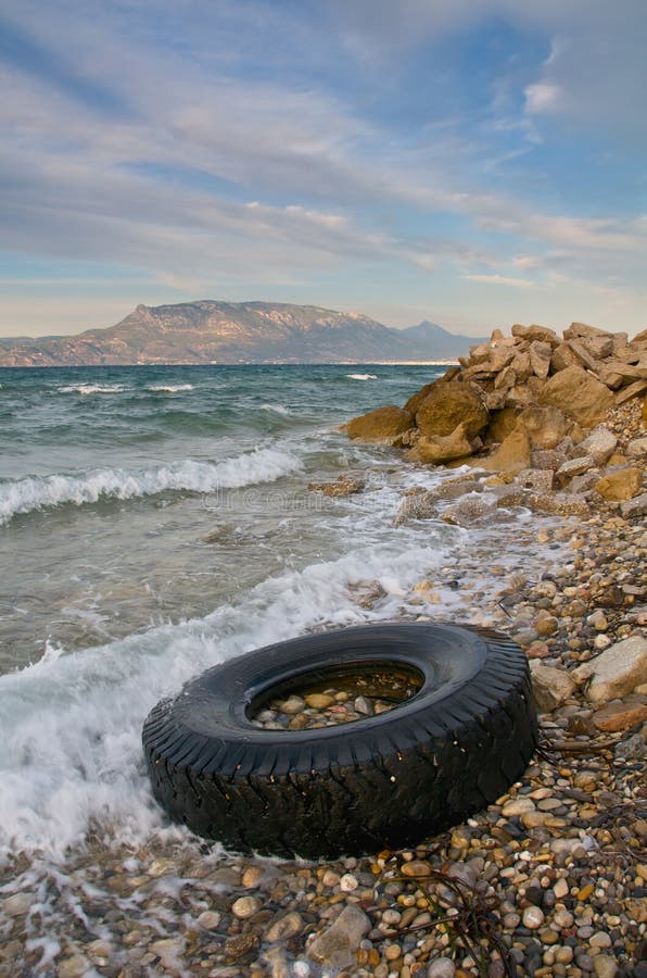 Lorry Tyre On Sea Shore - Pollution Stock Photo - Image of ...