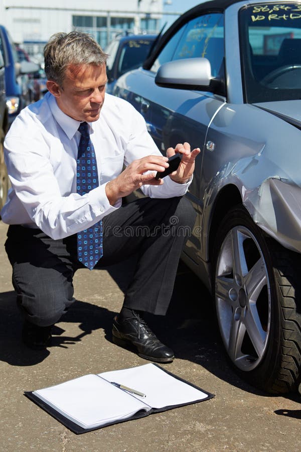Loss Adjuster Inspecting Car Involved in Accident Stock Photo - Image ...