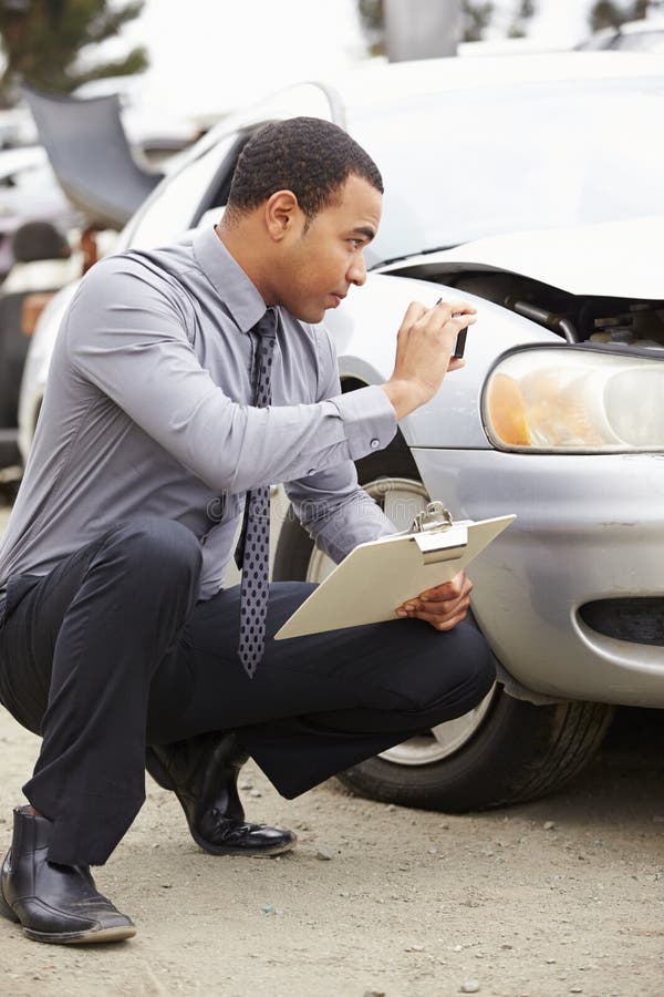 Loss Adjuster Taking Photograph of Damage To Car Stock Photo - Image of ...
