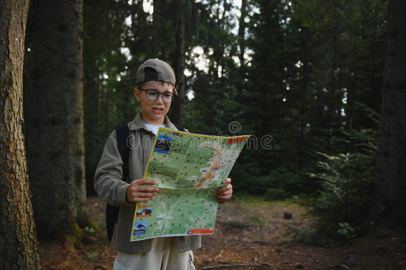 Lost Boy Scout Reading Map in Forest Stock Image - Image of hiking, exploration: 405735363