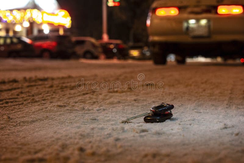 Lost Car Keys on the Road Powdered with the First Snow at Night. on ...