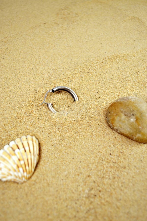Lost earring at the beach stock image. Image of natural - 286260901