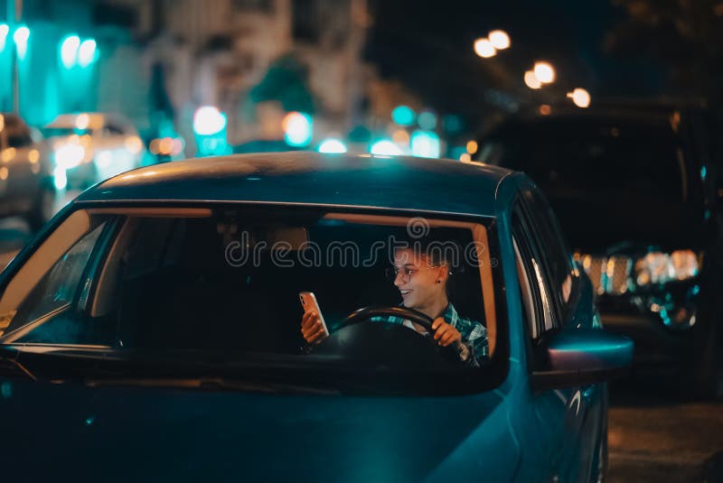 Lost Female Driver Using Mobile Phone while Driving at Night. Stock ...