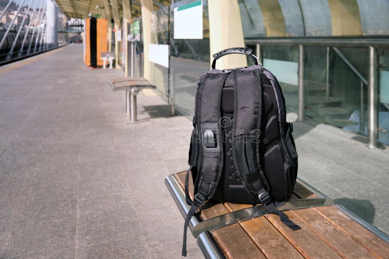A Lost or Forgotten Backpack on a Bench on an Open Platform of a City ...
