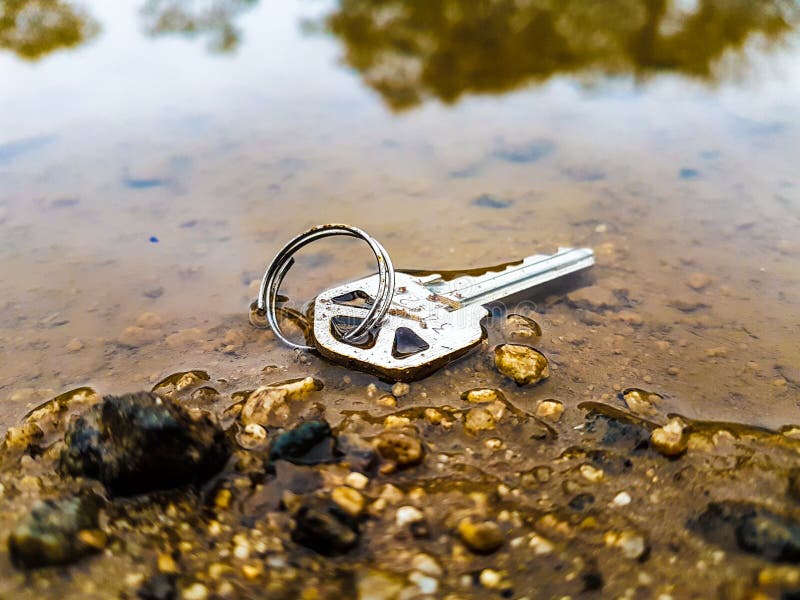 Lost key in some water stock image. Image of silver - 179229085