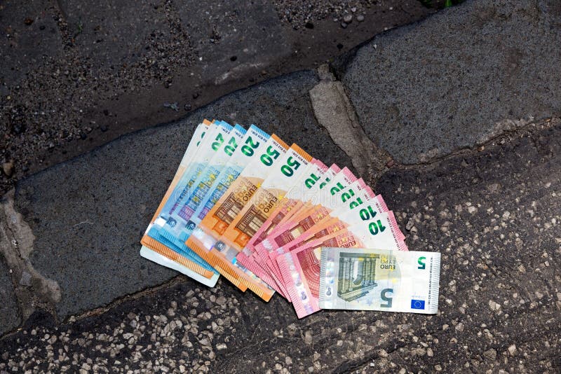 Lost money on the sidewalk stock photo. Image of road - 181792810