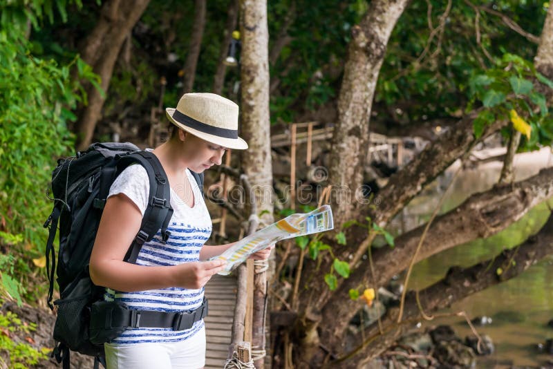 Lost Tourist with a Map and a Backpack is Looking Stock Photo - Image ...
