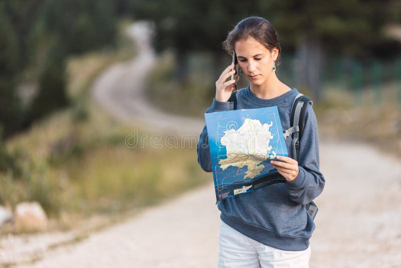 Lost Traveler with Map Talking on Smartphone Stock Photo - Image of ...