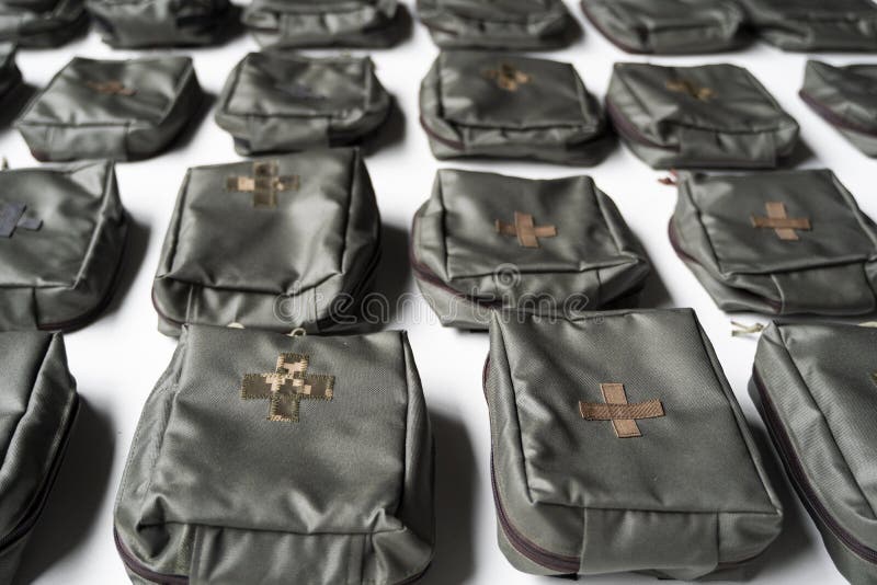 A Lot of Army First Aid Kits on White Background. Stock Image - Image ...