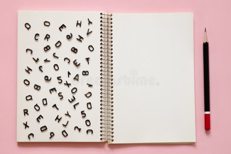 Black Small Letters of the English Alphabet on a Blank Notepad Page ...