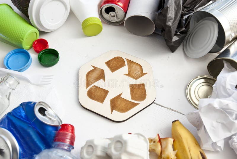 A Lot of Different Garbage on the Table and the Recycling Icon Stock ...
