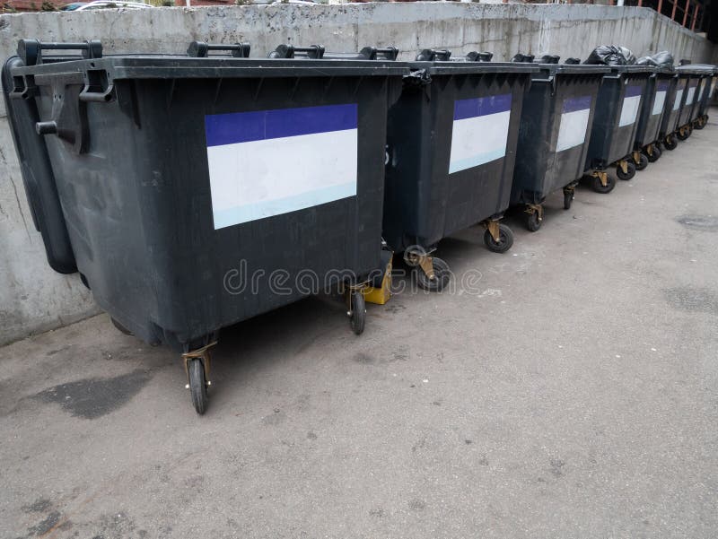 Lot of Garbage Containers Near Office Building Stock Photo - Image of ...