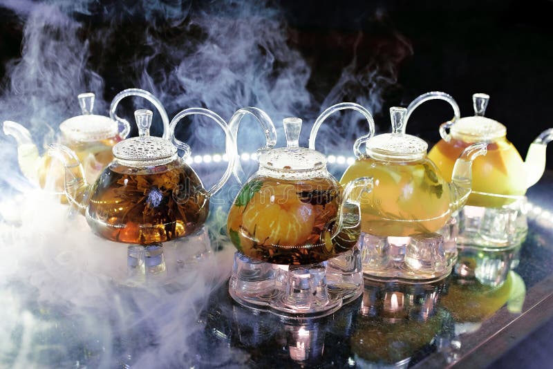 A Lot of Glass Teapots with Hot Tea on the Table in the Smoke Stock ...