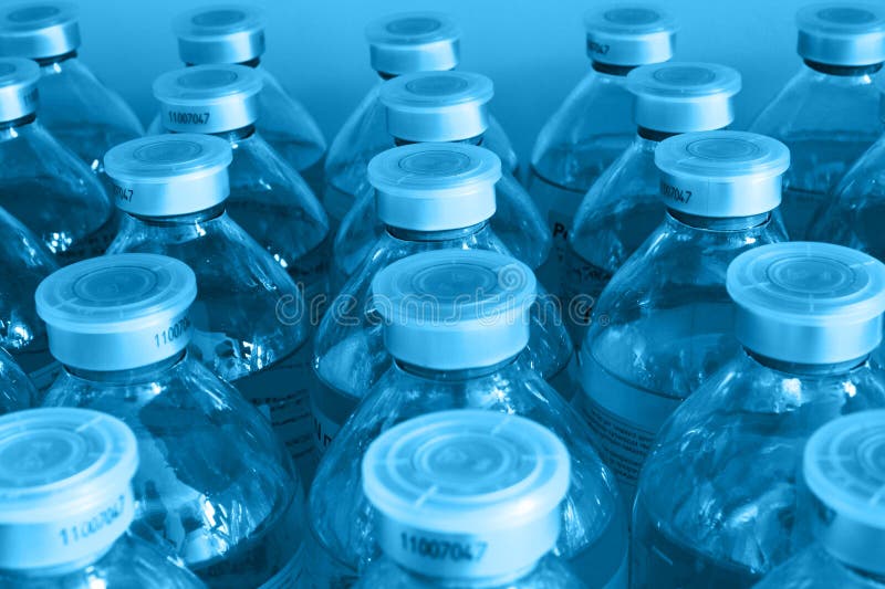 Lot of Identical Bottle with the Liquid. Stock Image - Image of glass ...