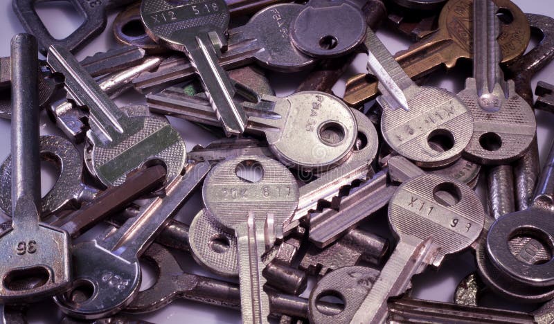 A Lot of Keys Different Sizes and Colours on the White Backgroun ...
