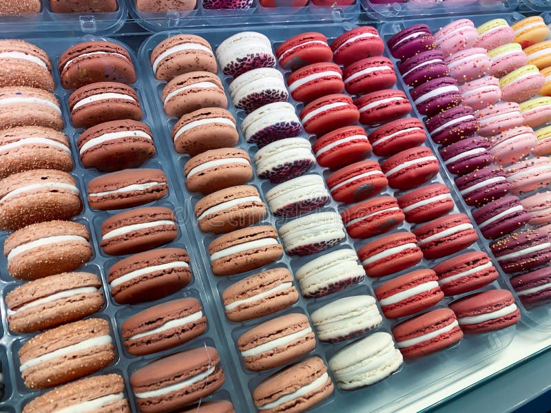 A Lot of Macarones, Macaroons in Brown Colors Lying in a Row in a Candy ...