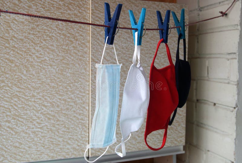 A Lot of Masks Hanging on the Rope.Indoor Shoot Stock Image - Image of ...