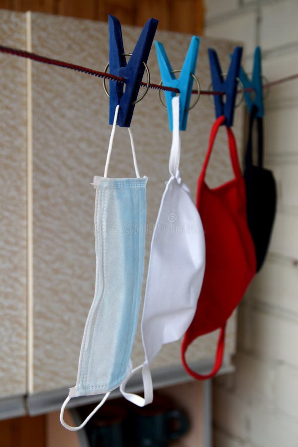 A Lot of Masks Hanging on the Rope.Indoor Shoot Stock Photo - Image of ...