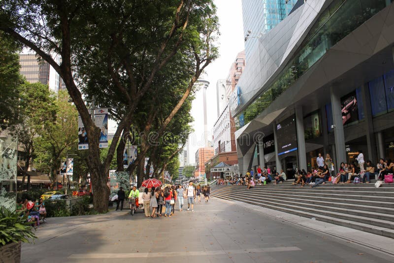 A Lot of People Walking and Sitting in Front of MRT Station in ...