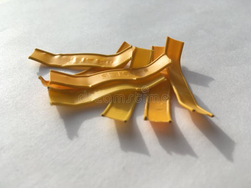 A Lot of Pieces of Yellow Wire Lying on a White Background. Stock Photo ...