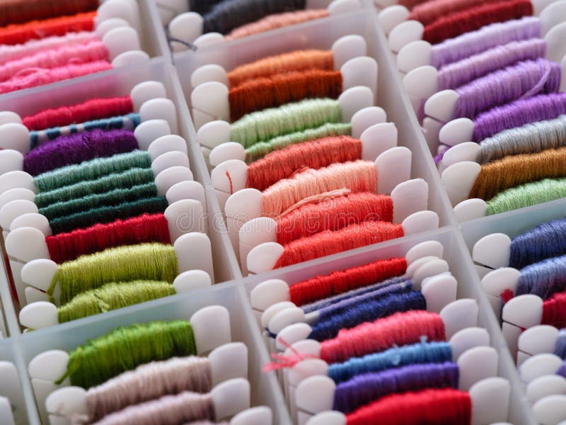 A Lot of Plastic Bobbins with Different Colour Embroidery Threads in ...