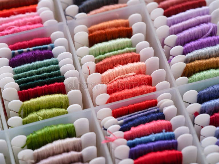 A Lot of Plastic Bobbins with Different Colour Embroidery Threads in ...