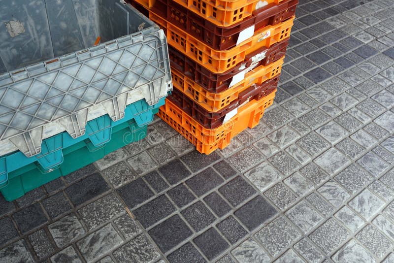 A Lot of a Plastic Boxes on the Front of a Store Shop on the Grounds ...