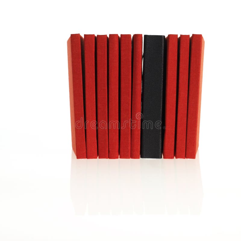 A Lot of Red Books with a Black One in between Stock Photo - Image of ...
