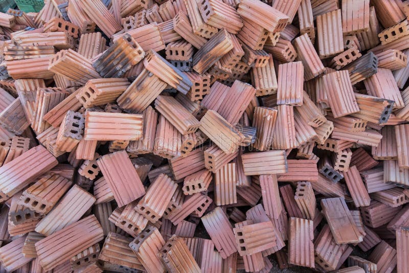 A Lot of Red Bricks are Stacked on the Floor. Piles of Red Construction ...