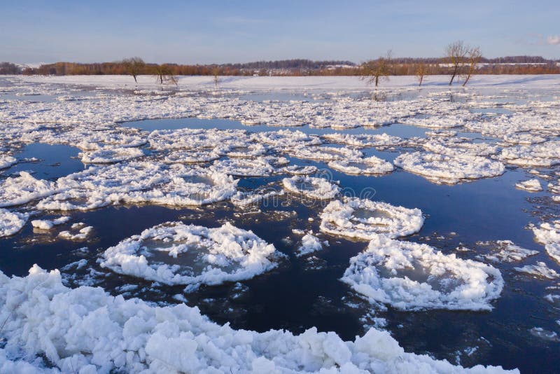 A Lot of Round Ice is Floating Along the Shore. Ice Drift, Melting Snow ...