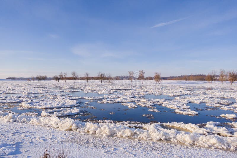 A Lot of Round Ice is Floating Along the Shore. Ice Drift, Melting Snow ...