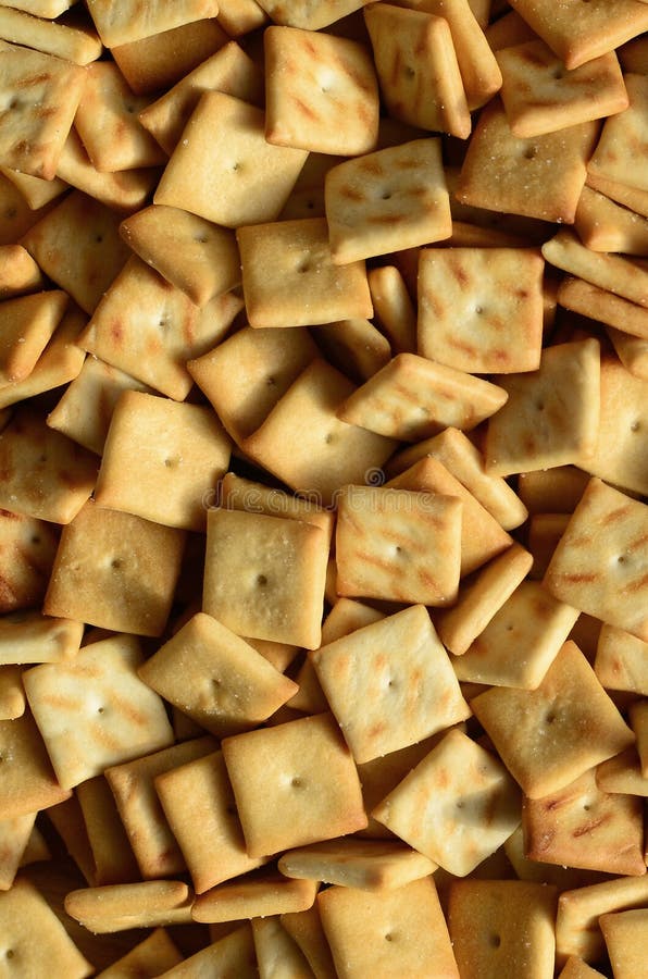 A Lot of Small Cookies are Square Shaped. a Pattern of a Yellow Salt ...