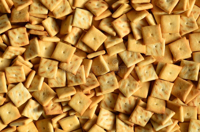 A Lot of Small Cookies are Square Shaped. a Pattern of a Yellow Salt ...