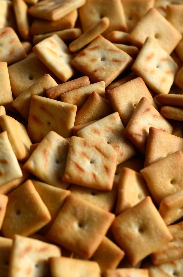 A Lot of Small Cookies are Square Shaped. a Pattern of a Yellow Salt ...