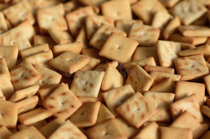 A Lot of Small Cookies are Square Shaped. a Pattern of a Yellow Salt ...