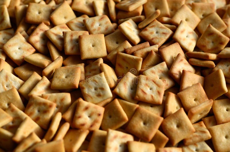 A Lot of Small Cookies are Square Shaped. a Pattern of a Yellow Salt ...