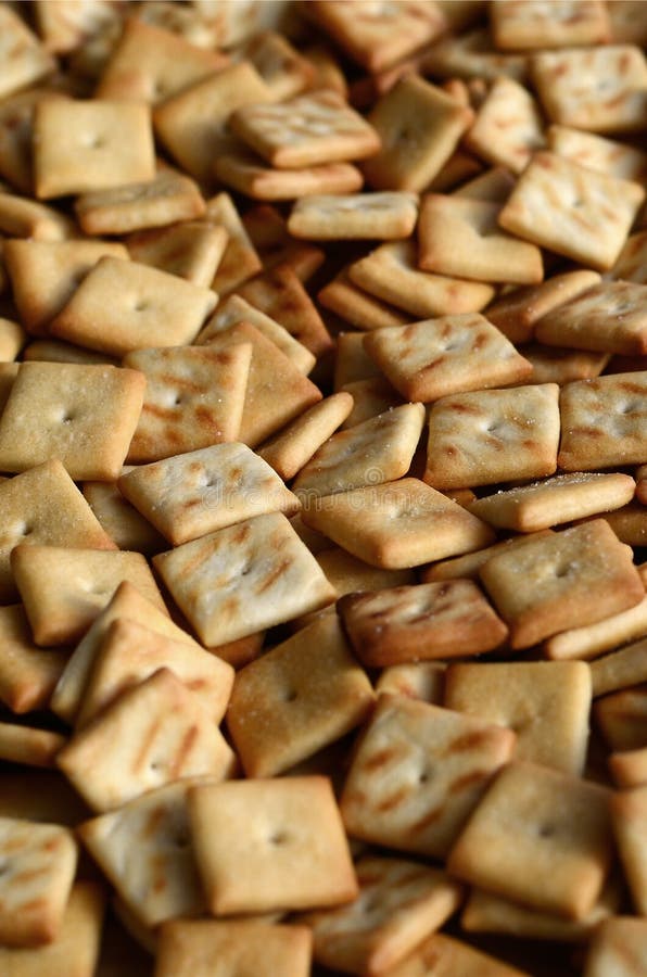 A Lot of Small Cookies are Square Shaped. a Pattern of a Yellow Salt ...