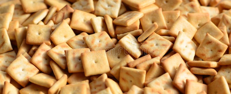 A Lot of Small Cookies are Square Shaped. a Pattern of a Yellow Salt ...