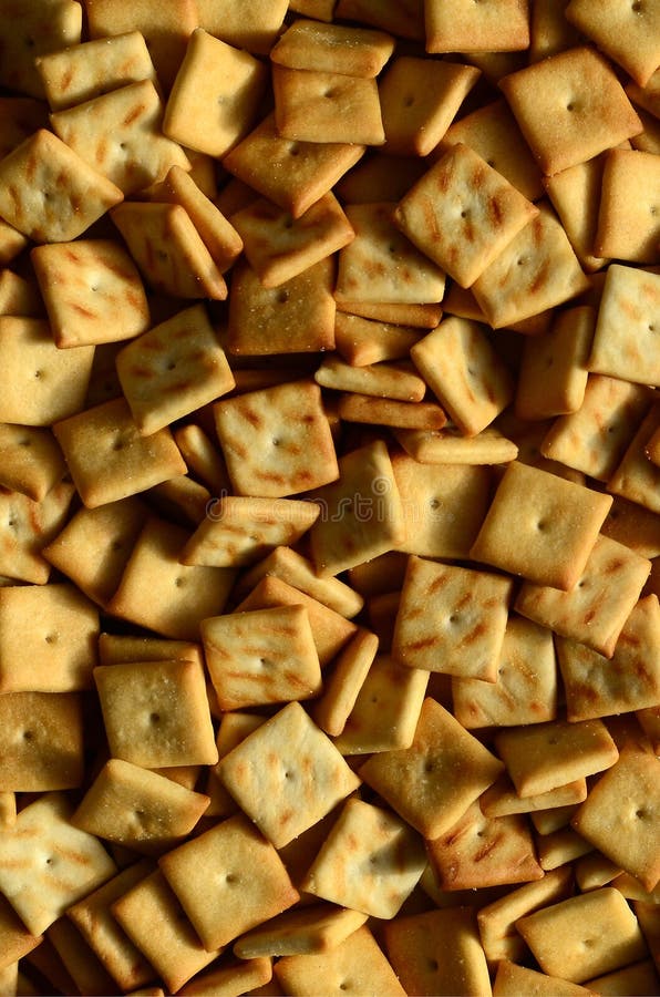 A Lot of Small Cookies are Square Shaped. a Pattern of a Yellow Salt ...