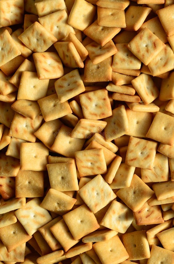 A Lot of Small Cookies are Square Shaped. a Pattern of a Yellow Salt ...