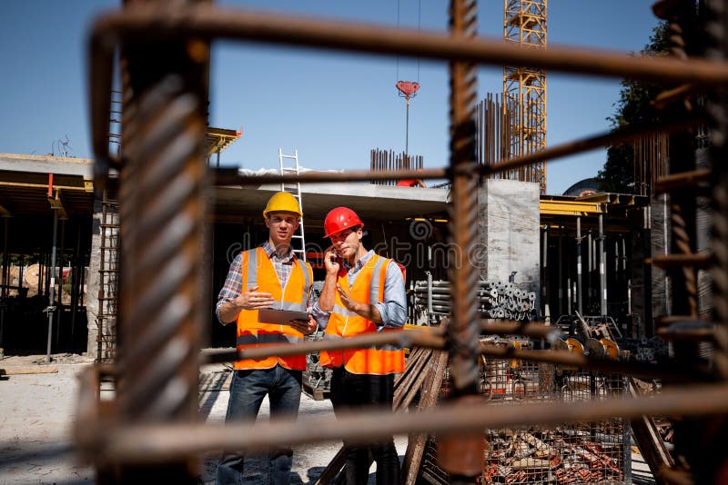 A Lot of Steel Frames. Architect and Structural Engineer in Orange Work ...