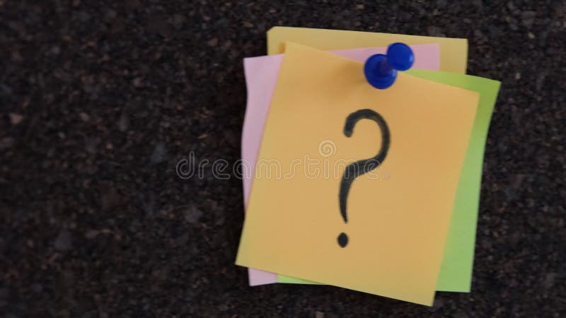 A Lot of Sticky Notes with a Question Mark on Them Pinned Onto a Cork ...