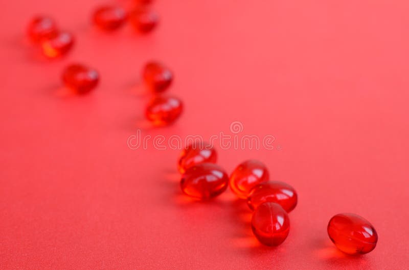 A Lot of Transparent Red Tablets Lie on the Red Surface Stock Image ...