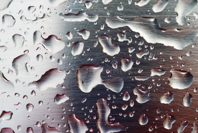 A Lot of Transparent Water Droplets on a Bright Metal Surface, with ...