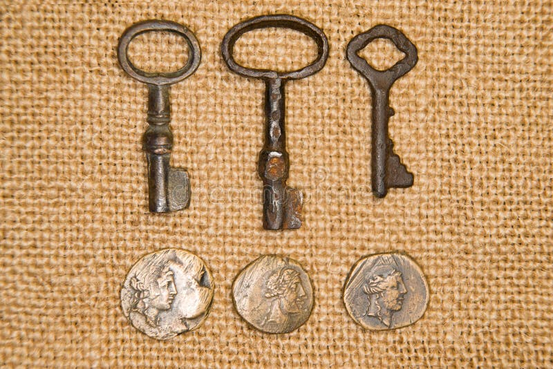 A Lot Vintage Keys from the Locks and Coins on Old Cloth Stock Photo ...