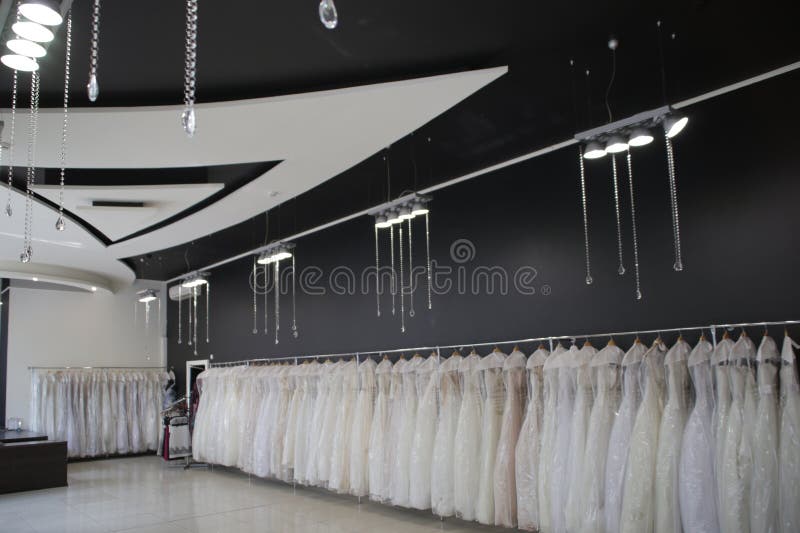 A Lot of Wedding Dresses on a Long Counter in the Store Stock Image ...