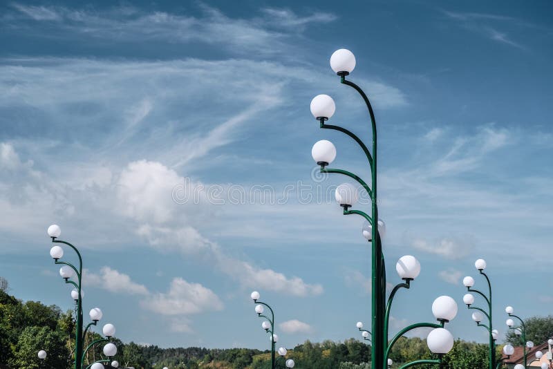 A Lot of White Round Lights on Sky Background with White Clouds Stock ...