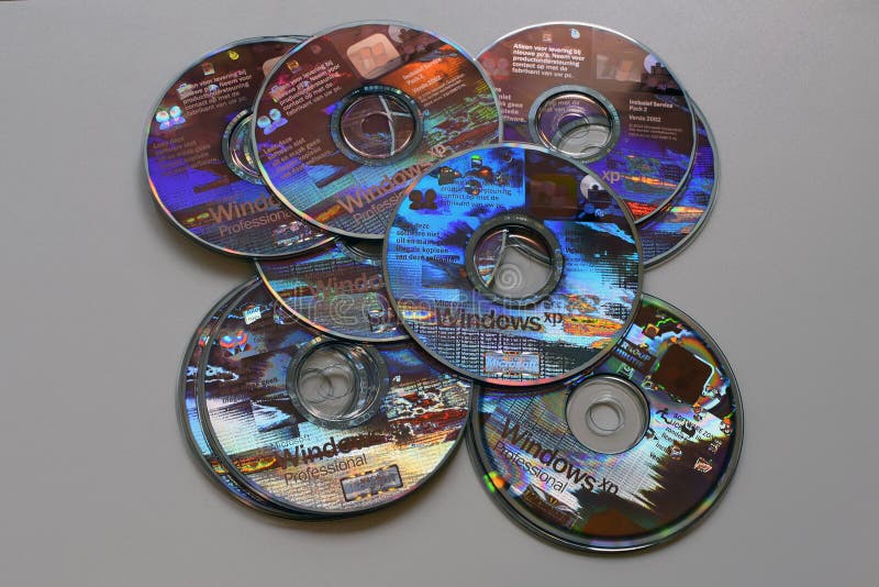 A Lot of Windows XP Cd`s on the Table Editorial Stock Image - Image of ...